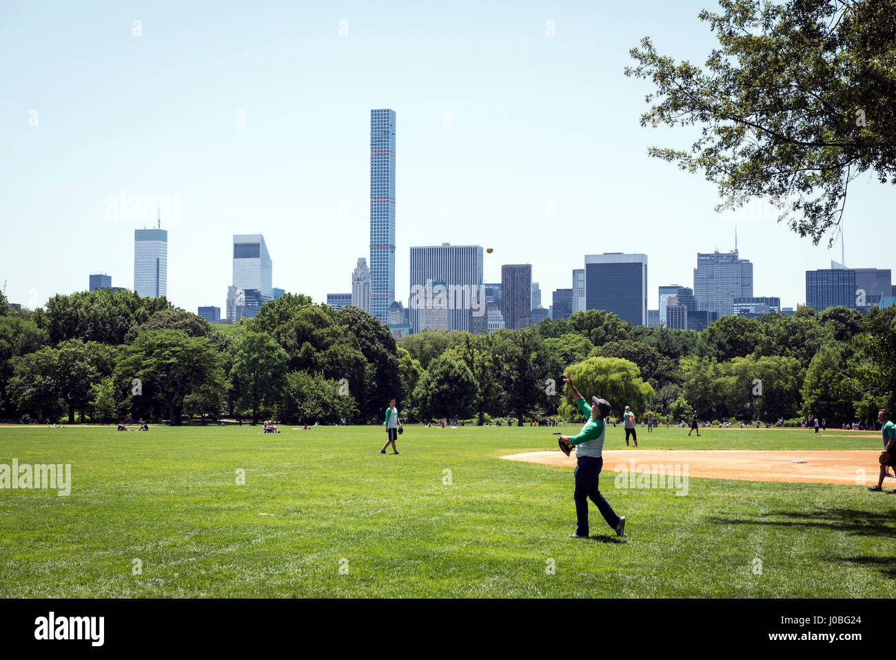 People playing baseball the in Central Park in New York, United States ...
