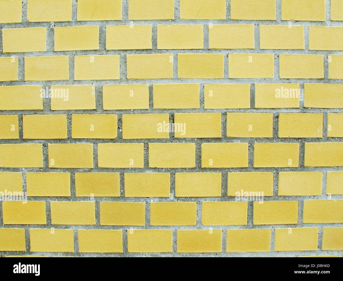 yellow brickstone wall. background Stock Photo - Alamy