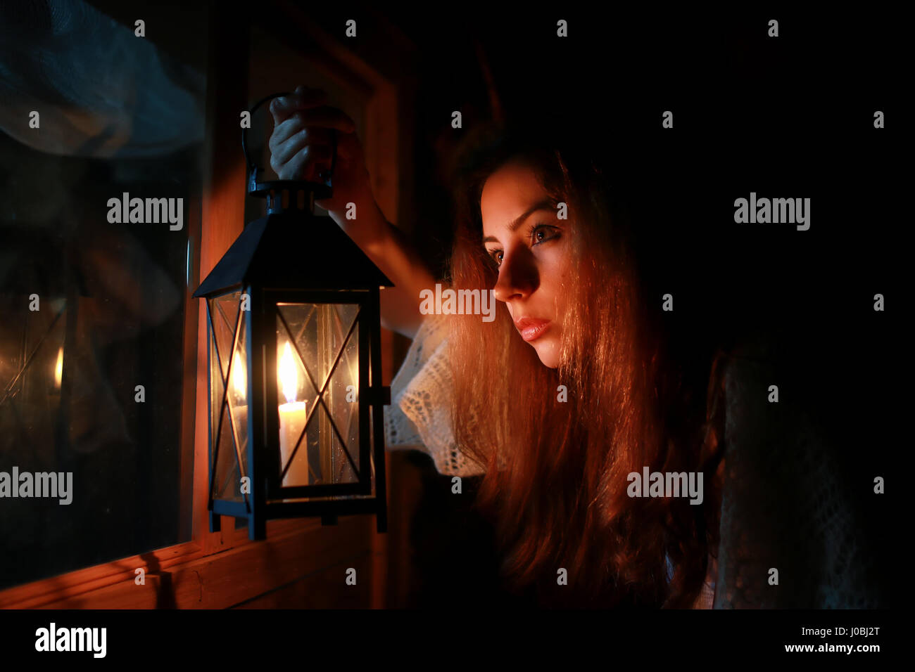 woman candle lamp dark night Stock Photo - Alamy