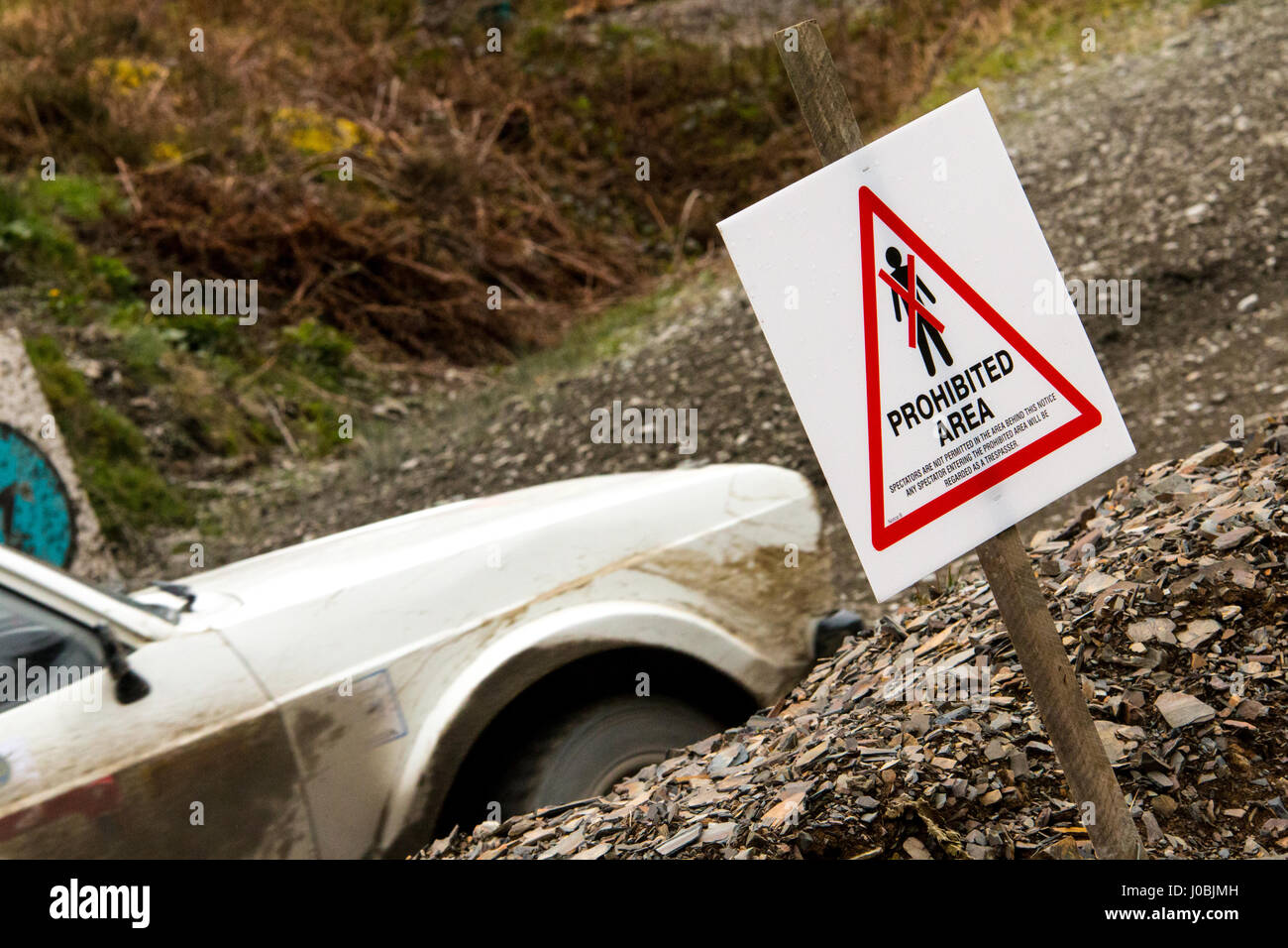 A view of a spectator safety sign on a motorsport forest rally event ...