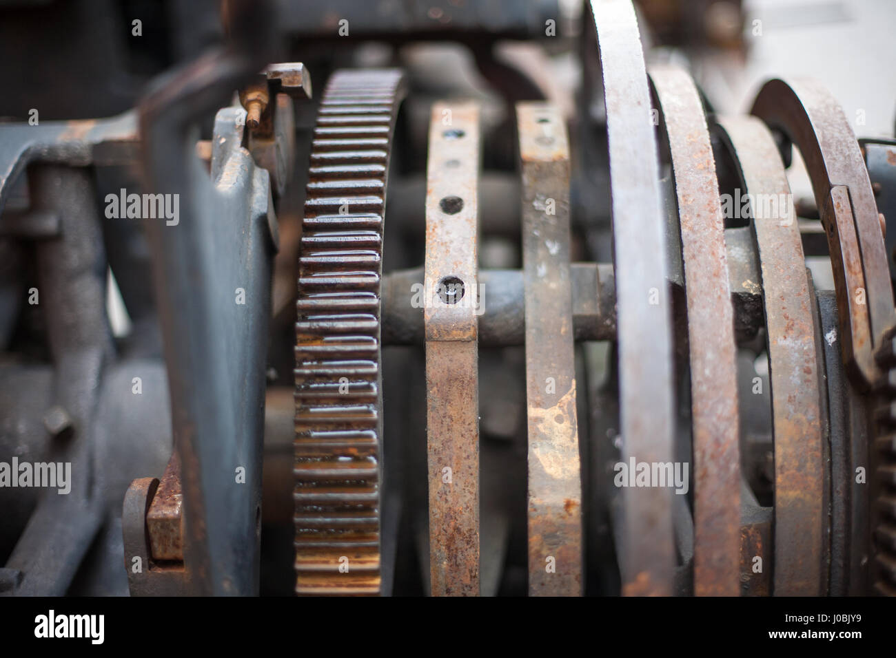 Old rusty printing machine complex mechanism of metal with close up ...