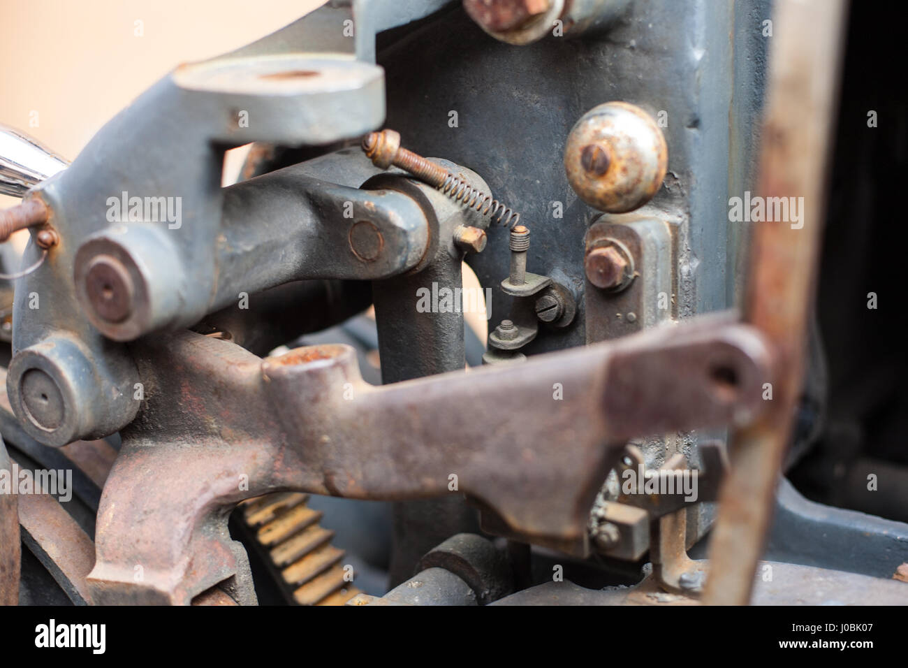 Old rusty printing machine complex mechanism of metal with close up ...