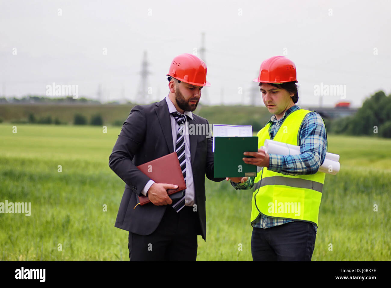 construction two man in the field Stock Photo - Alamy
