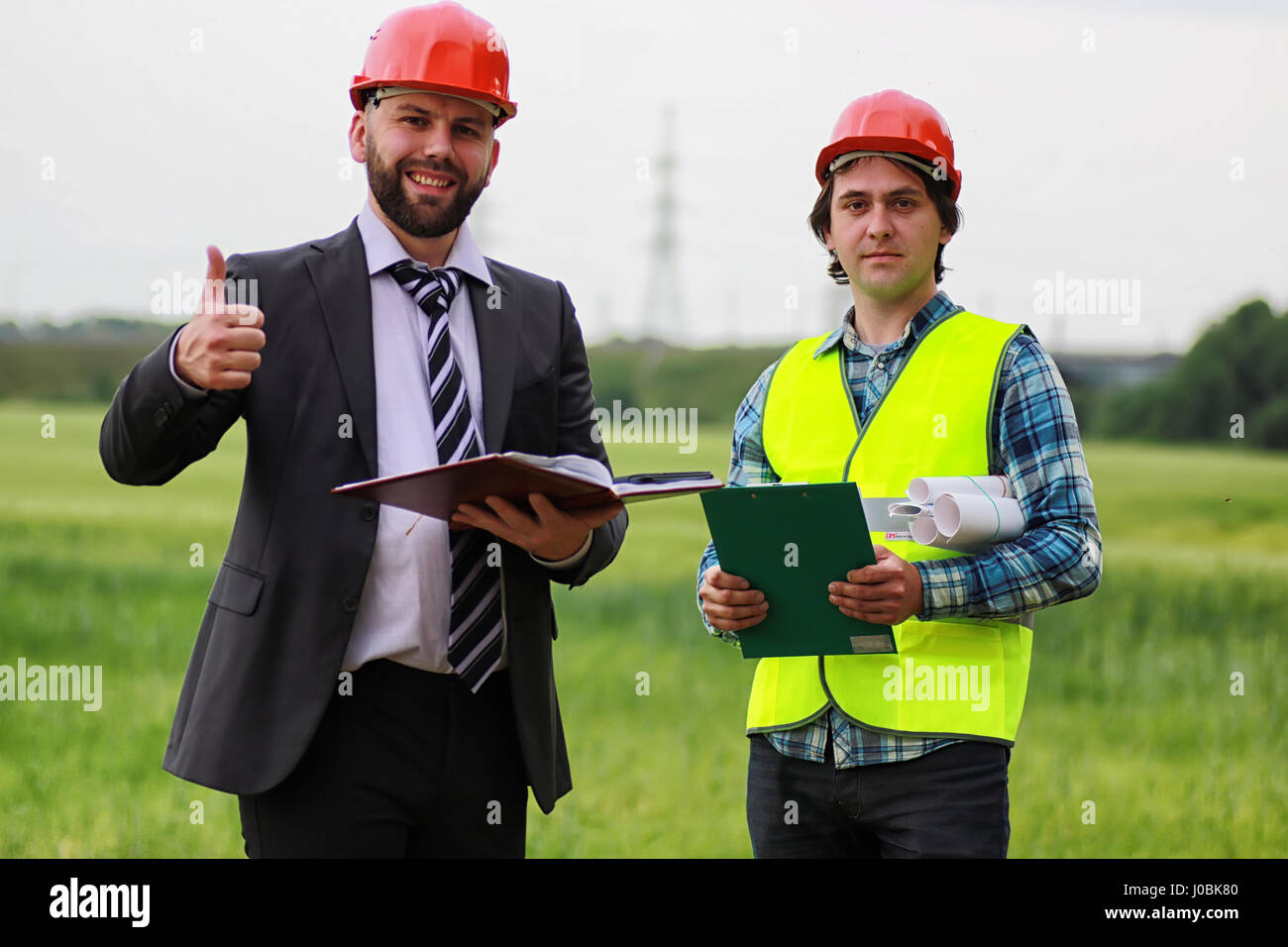 construction two man in the field Stock Photo - Alamy