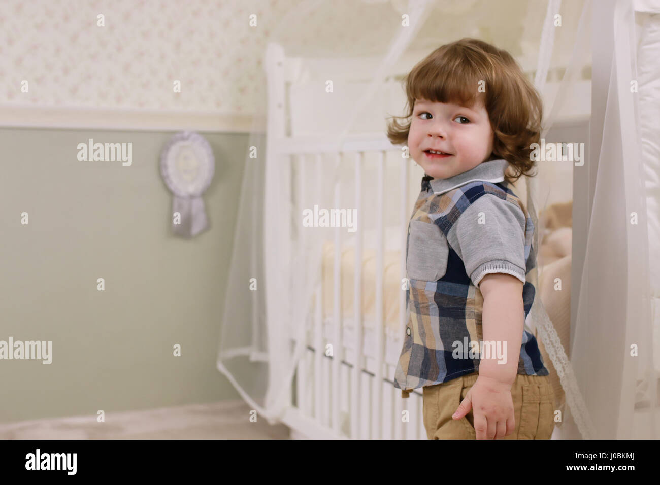 litle kid stand at bedroom Stock Photo - Alamy