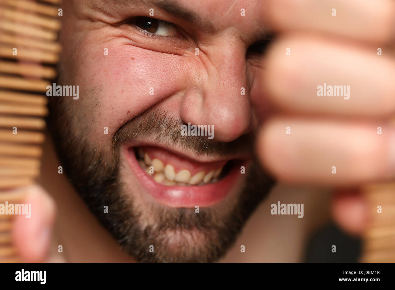 angry man at the jalousie Stock Photo - Alamy