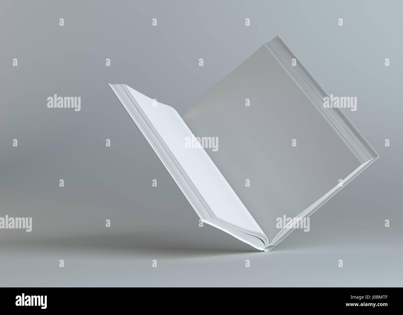 White empty open book on gray background Stock Photo - Alamy