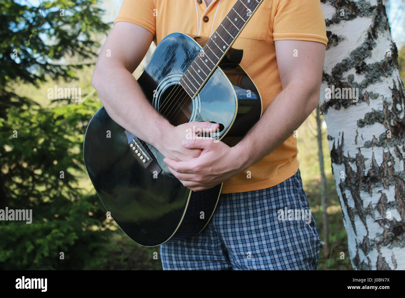 guitar string man hand outdoor Stock Photo - Alamy