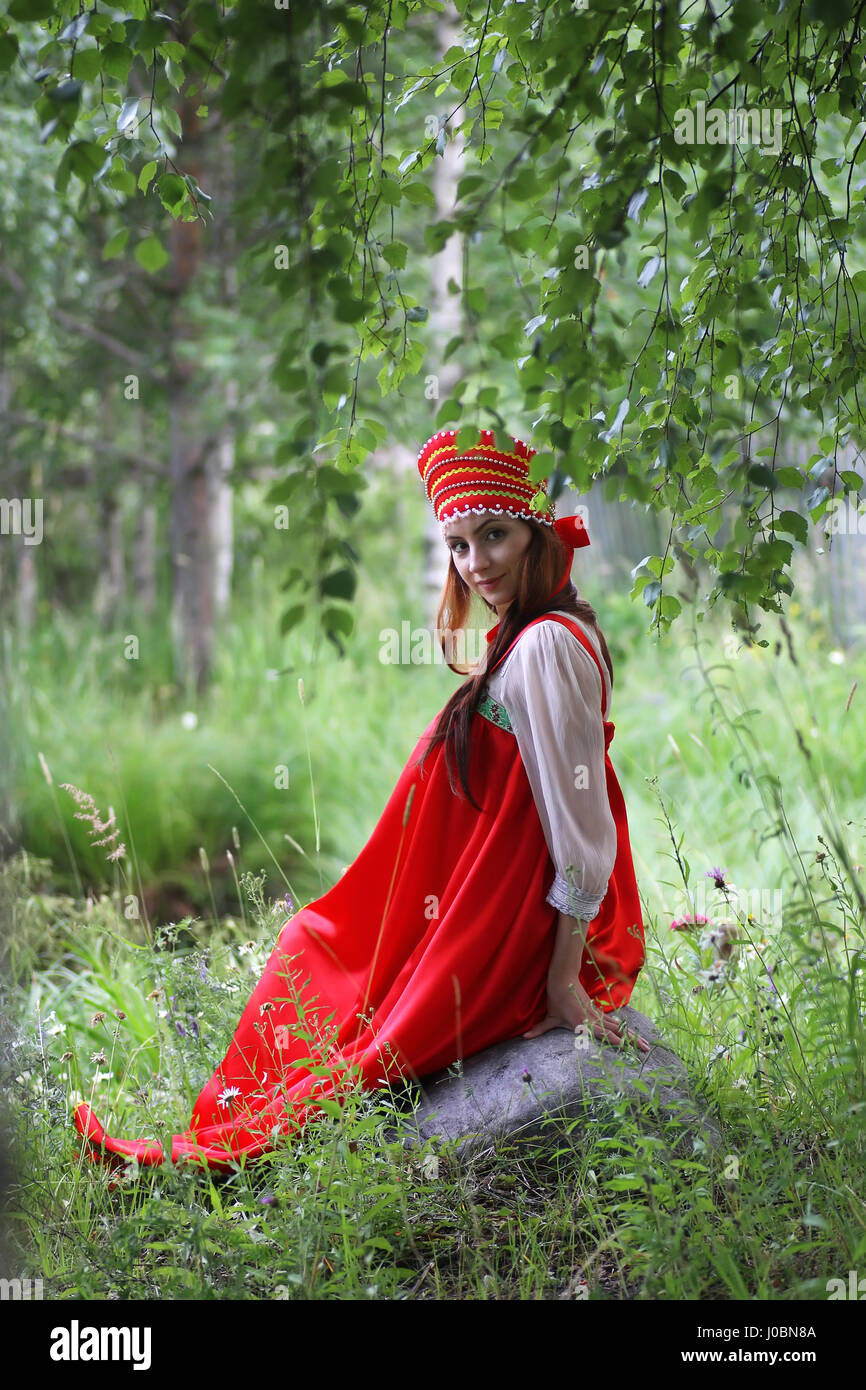 Slav in traditional dress is sitting in nature Stock Photo - Alamy