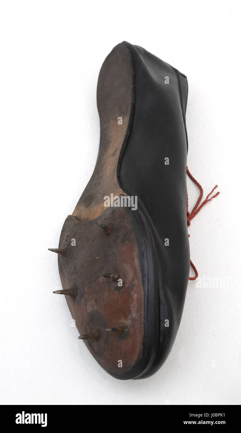 Vintage Leather Running Shoe Showing Spikes Stock Photo - Alamy