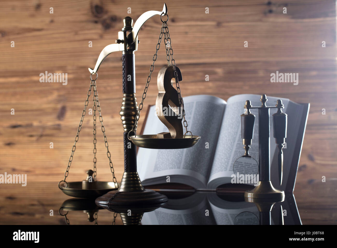 Law and justice concept. Scale of justice and legal code on wooden ...
