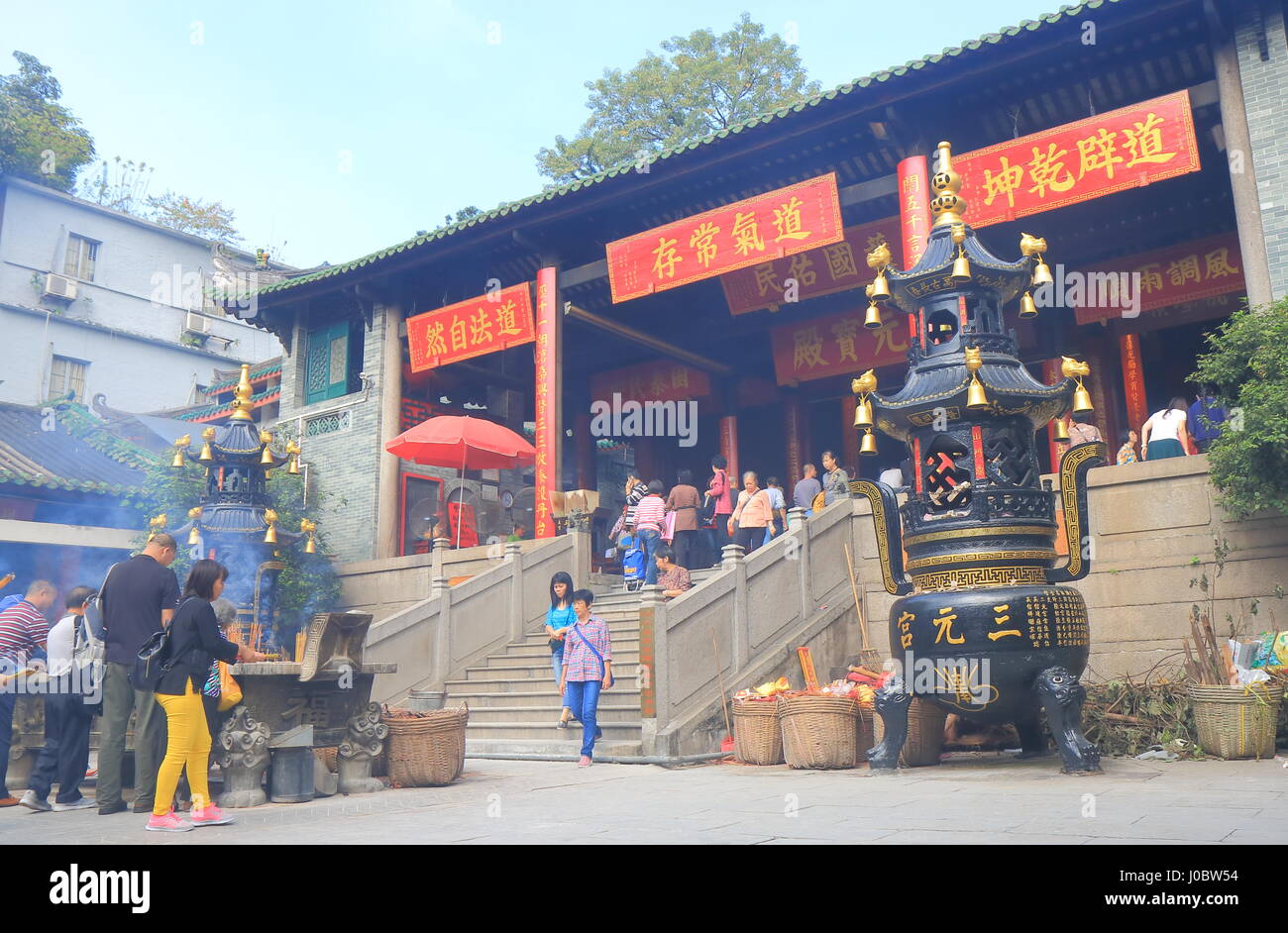 People visit Sanyuan Palace in Guangzhou China. Sanyuan Palace is a ...