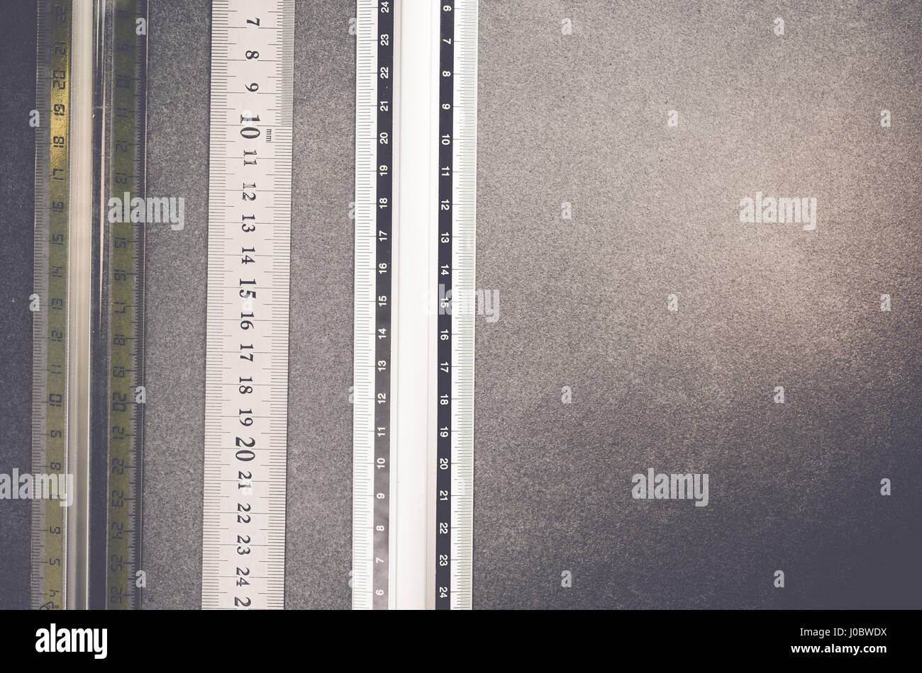 desk rulers on a stone surface worktop Stock Photo - Alamy
