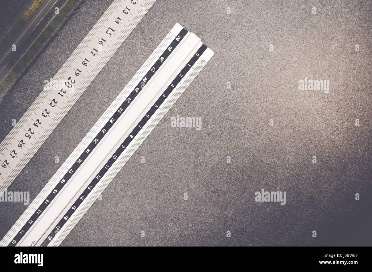 desk rulers on a stone surface worktop Stock Photo - Alamy
