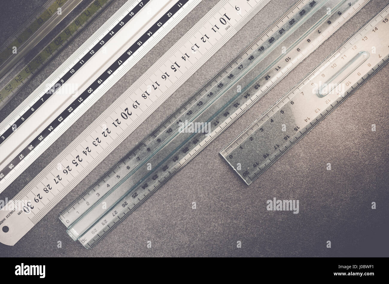 desk rulers on a stone surface worktop Stock Photo - Alamy