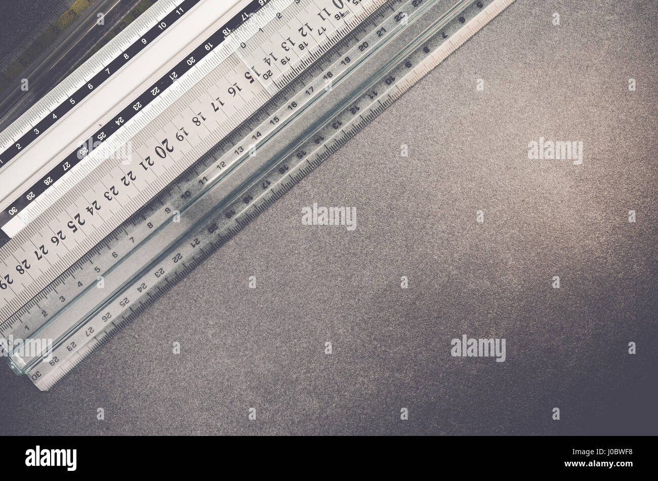 desk rulers on a stone surface worktop Stock Photo - Alamy