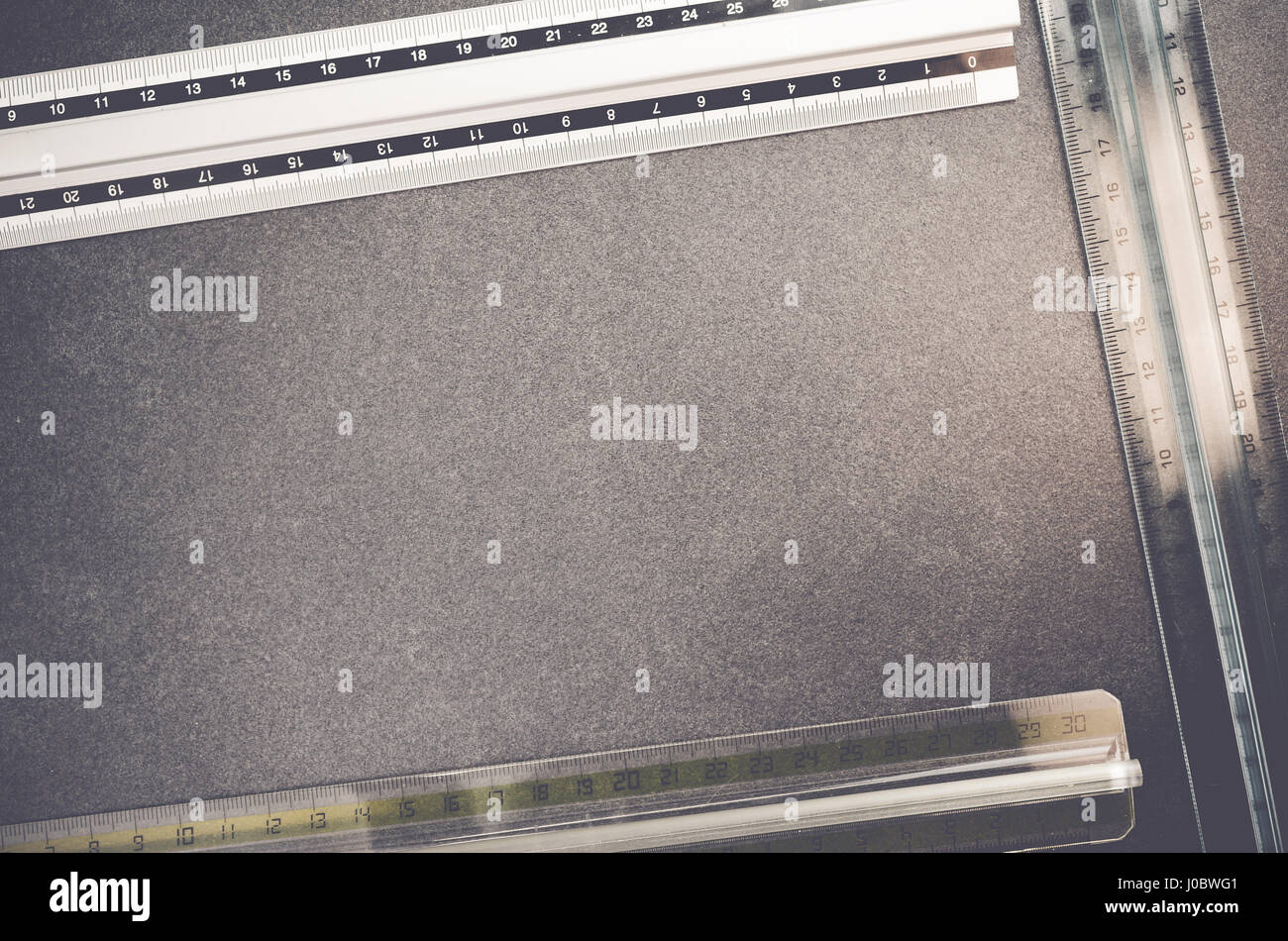 desk rulers on a stone surface worktop Stock Photo - Alamy