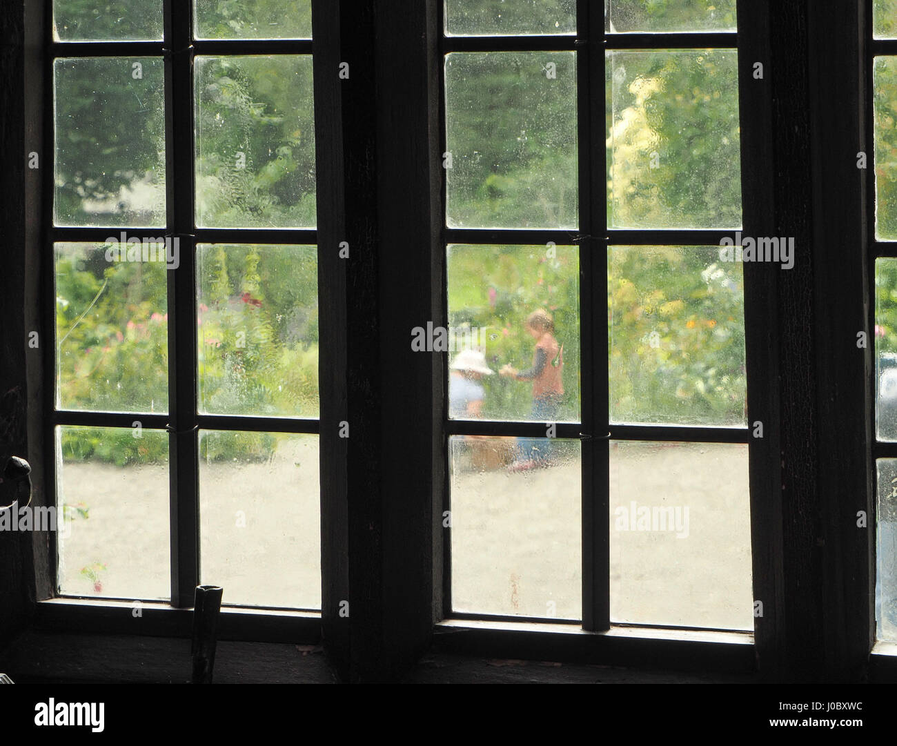Children playing out the window hi-res stock photography and images - Alamy