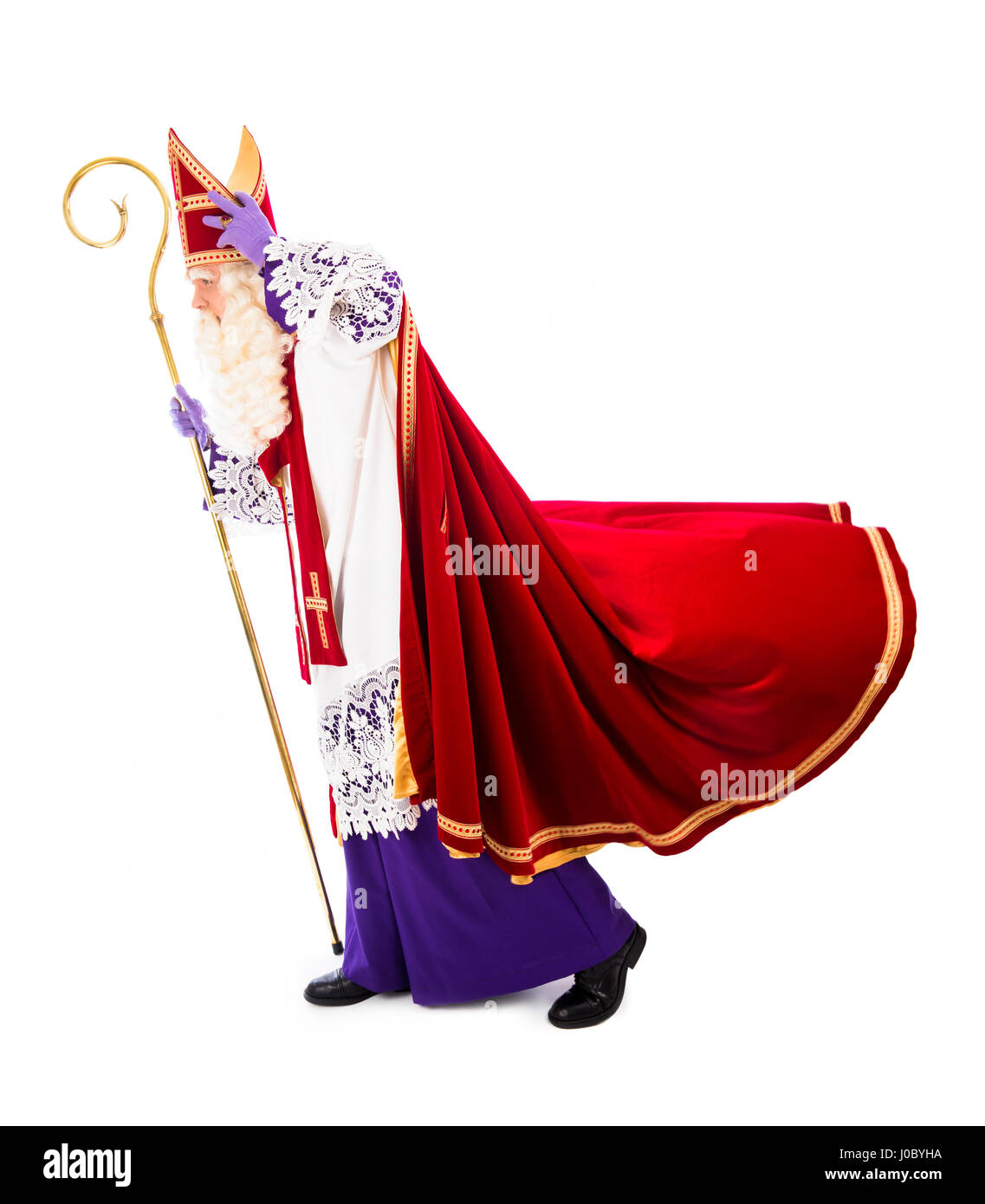 Sinterklaas holding hat in windy weather. isolated on white background ...