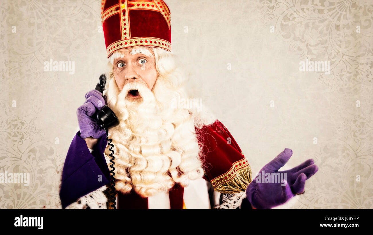 Sinterklaas with old vintage telephone. Dutch character of Santa Claus ...