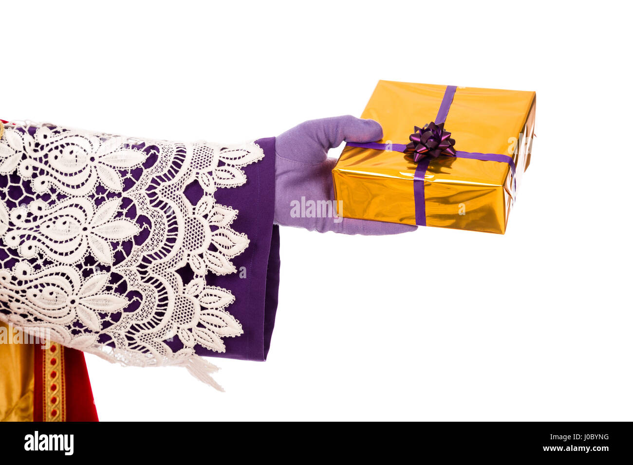Hand of sinterklaas with gift . typical Dutch character part of a ...