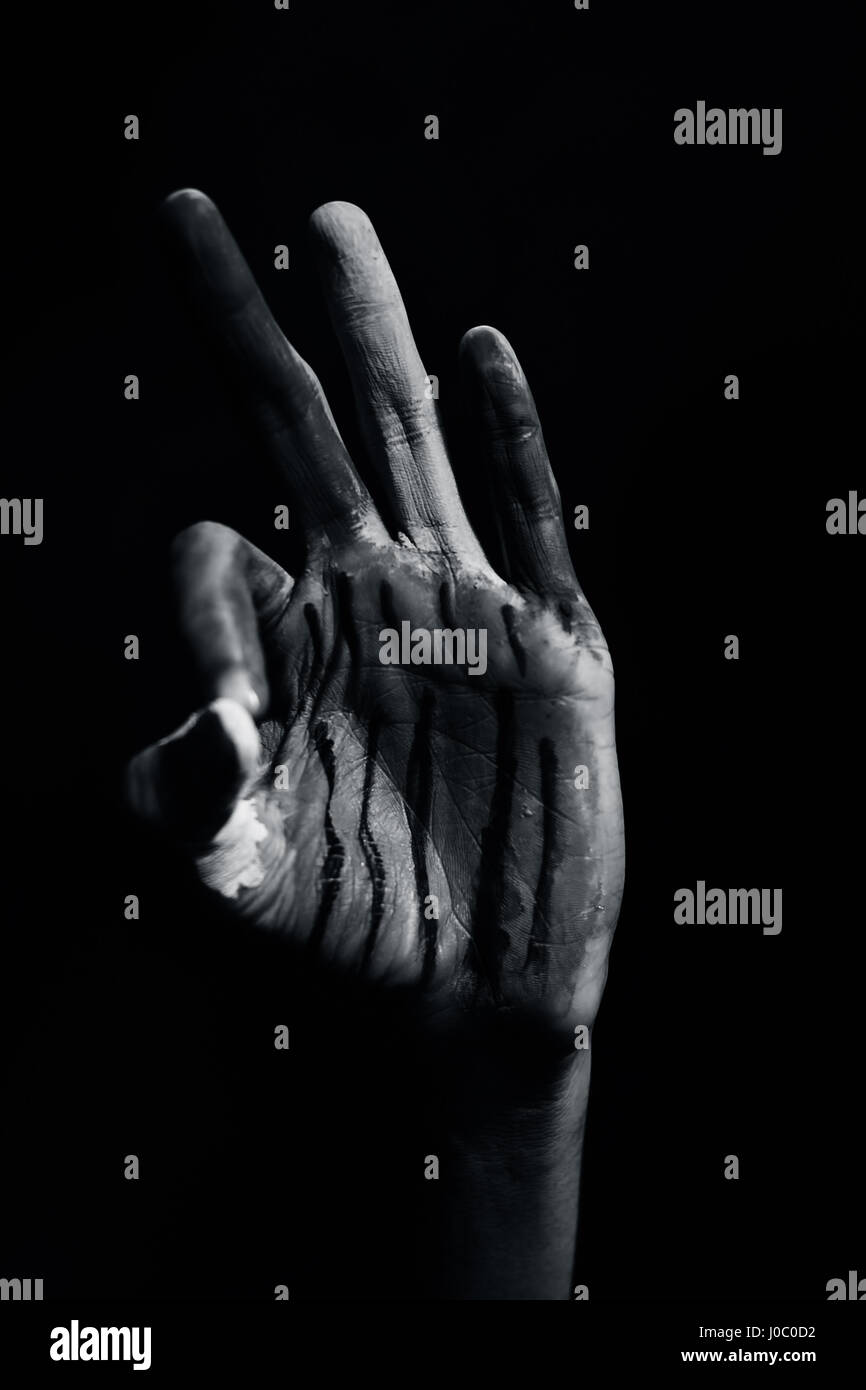 Tiger colored aggressive human painted hand with black strokes on it ...