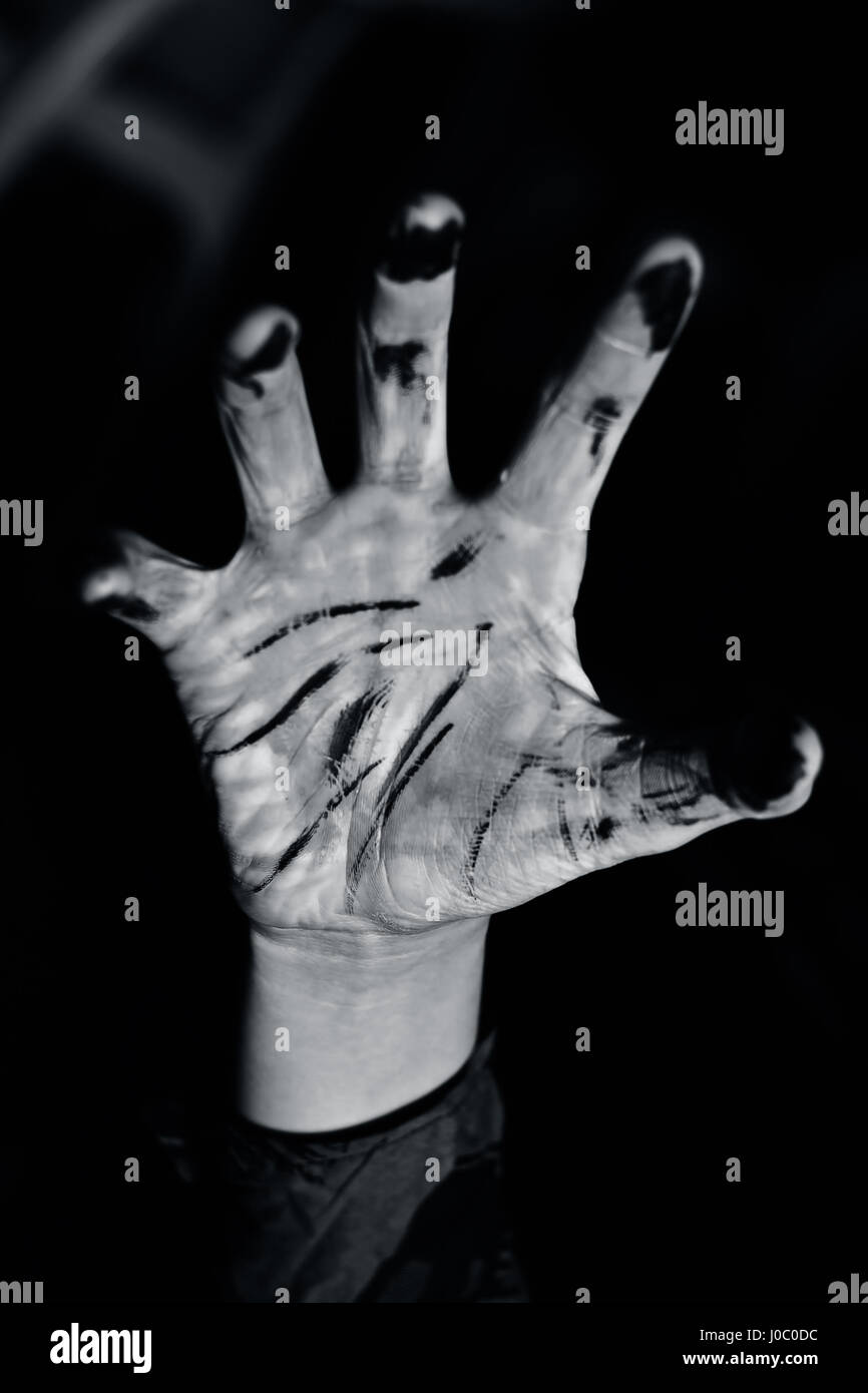 Tiger colored aggressive human painted hand.with black strokes on it ...