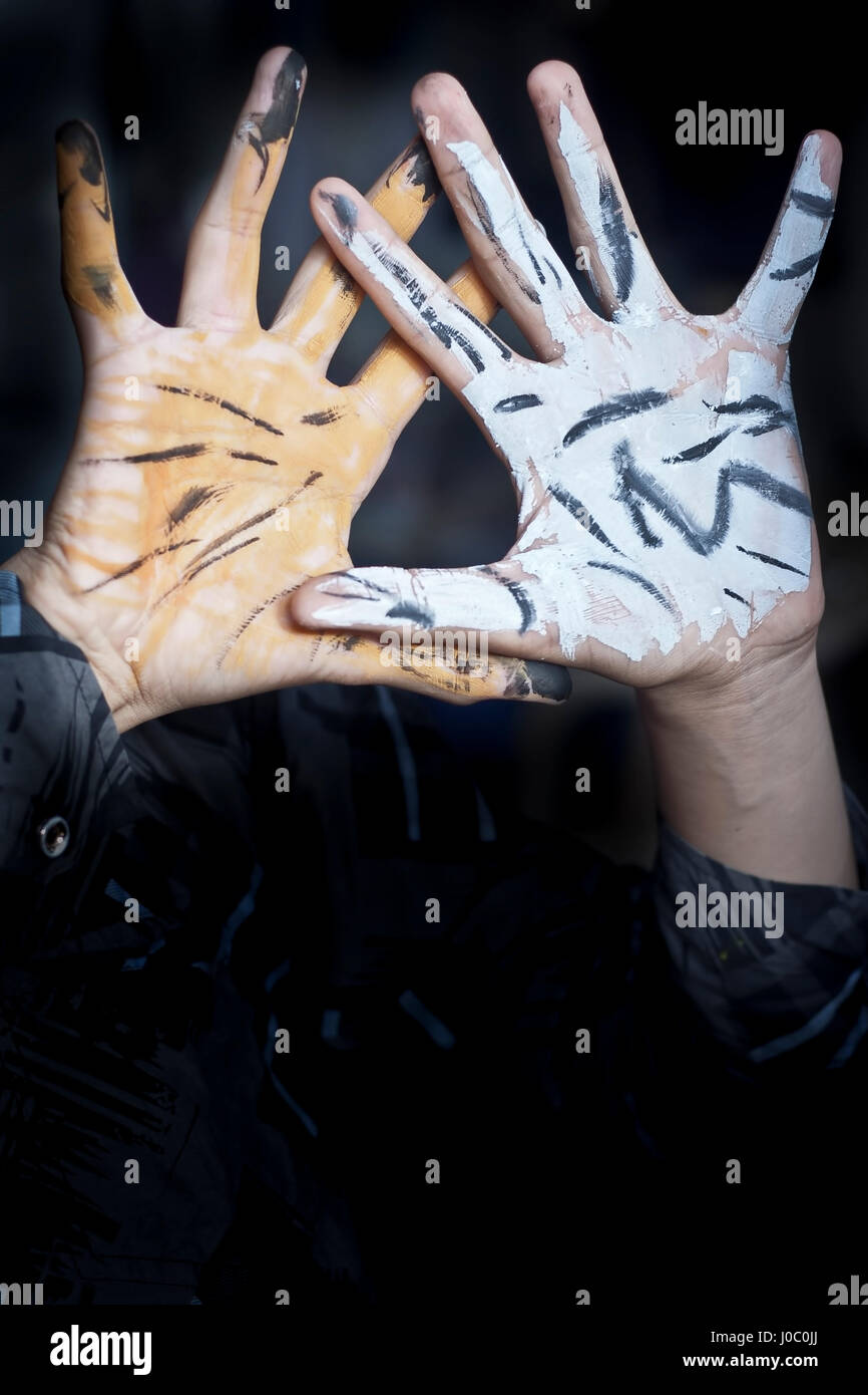 Two human aggressive painted hands Stock Photo - Alamy