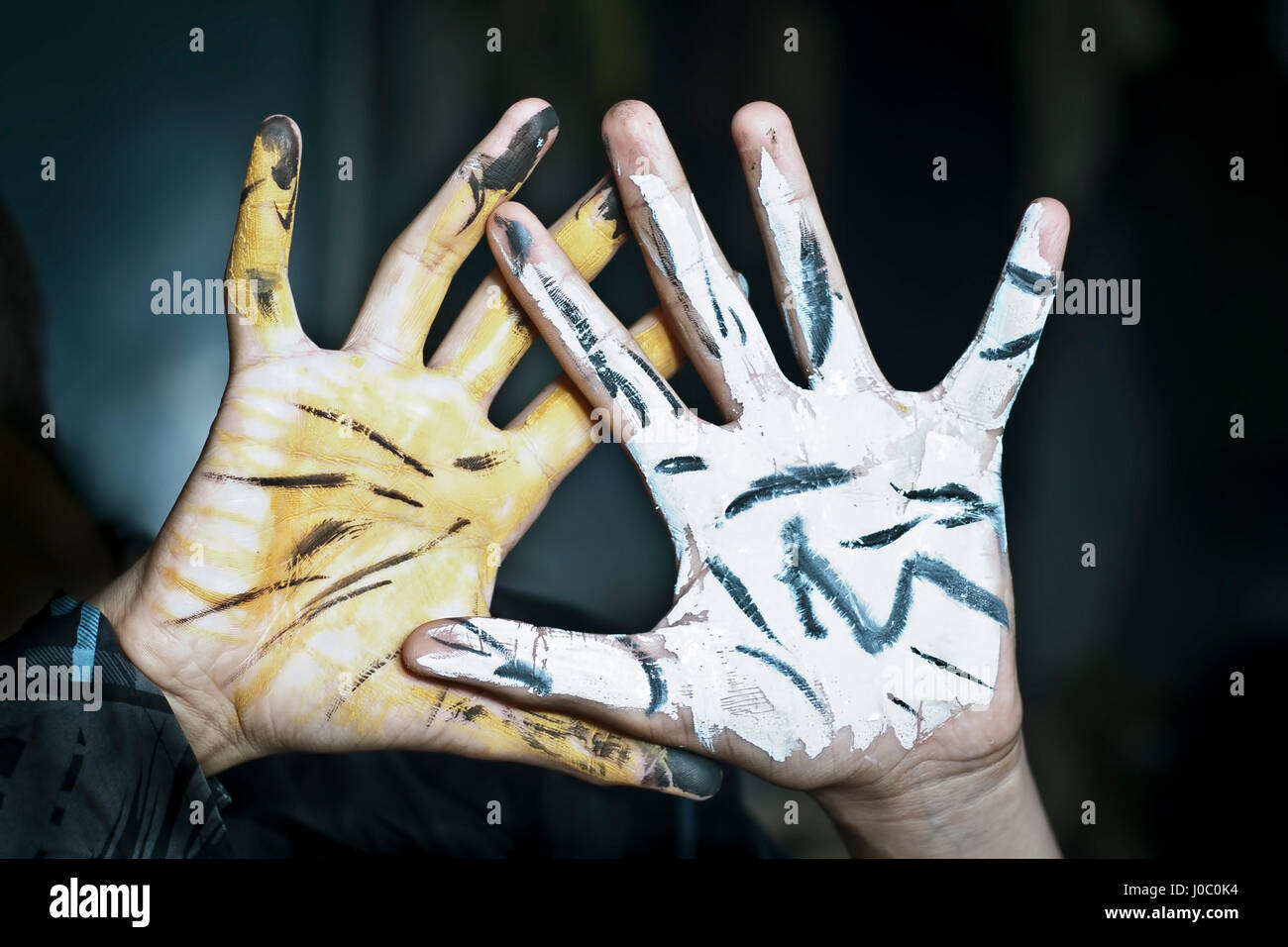 Two human aggressive painted hands Stock Photo - Alamy