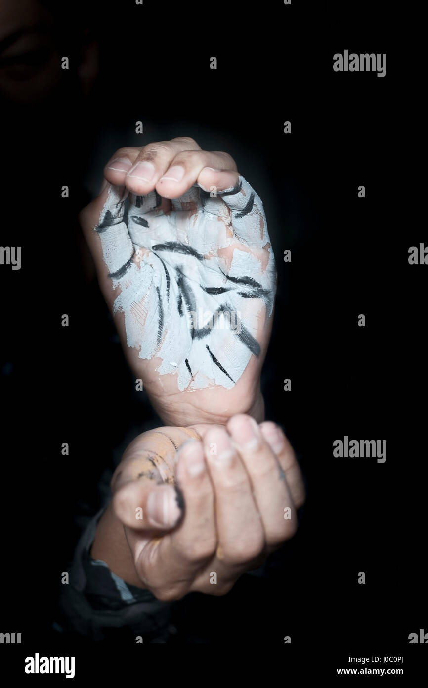 Painted hands forming snake like shape Stock Photo - Alamy