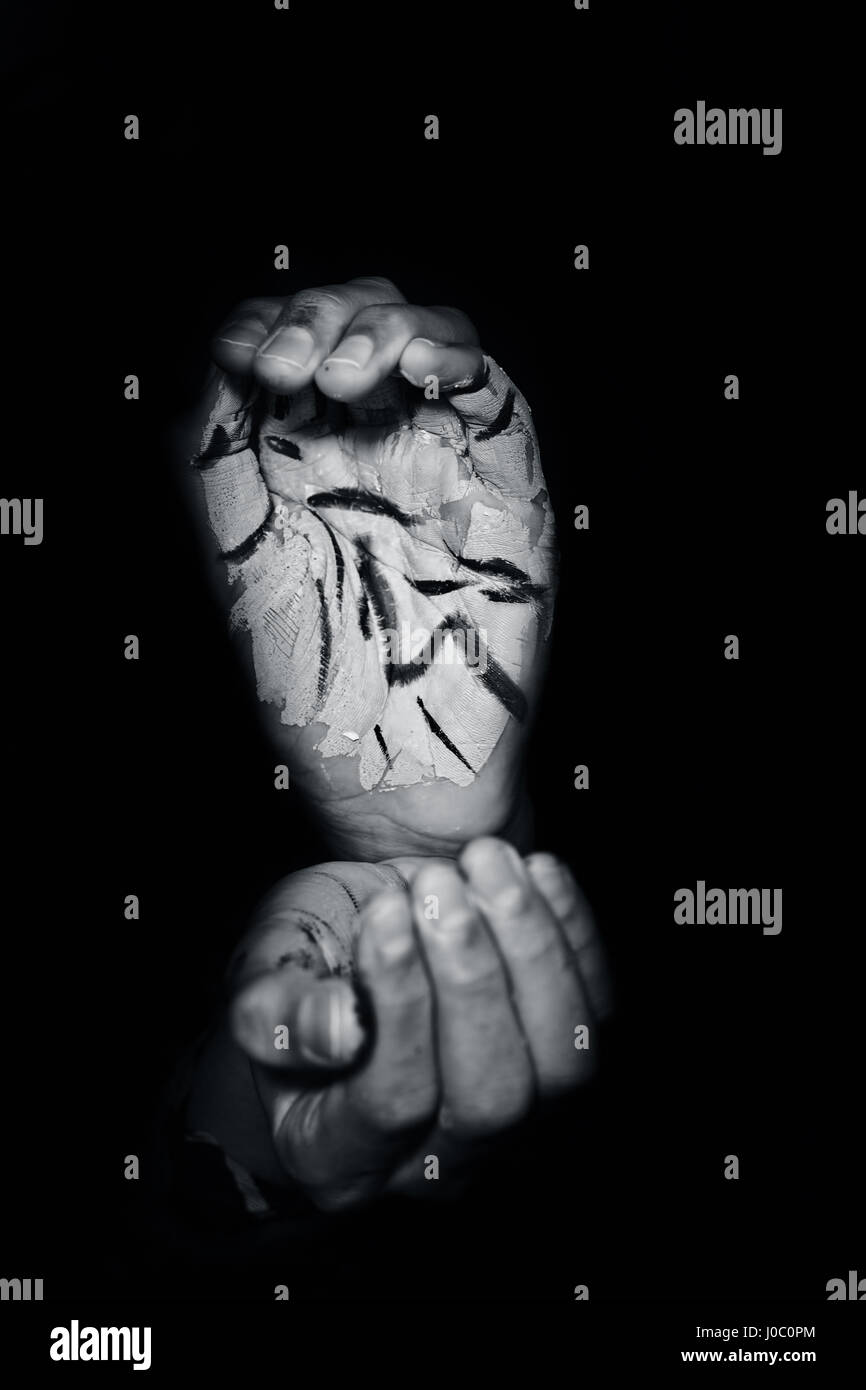 Painted hands forming snake like shape Stock Photo - Alamy