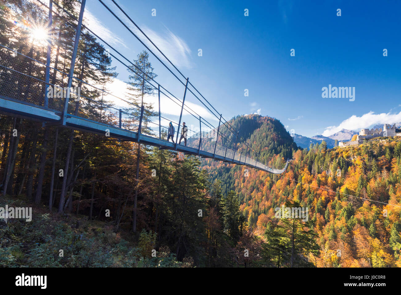 Tourists on the suspension bridge called Highline 179 framed by ...