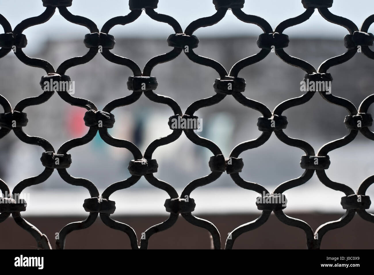 Old window covered with a metal grate Stock Photo - Alamy