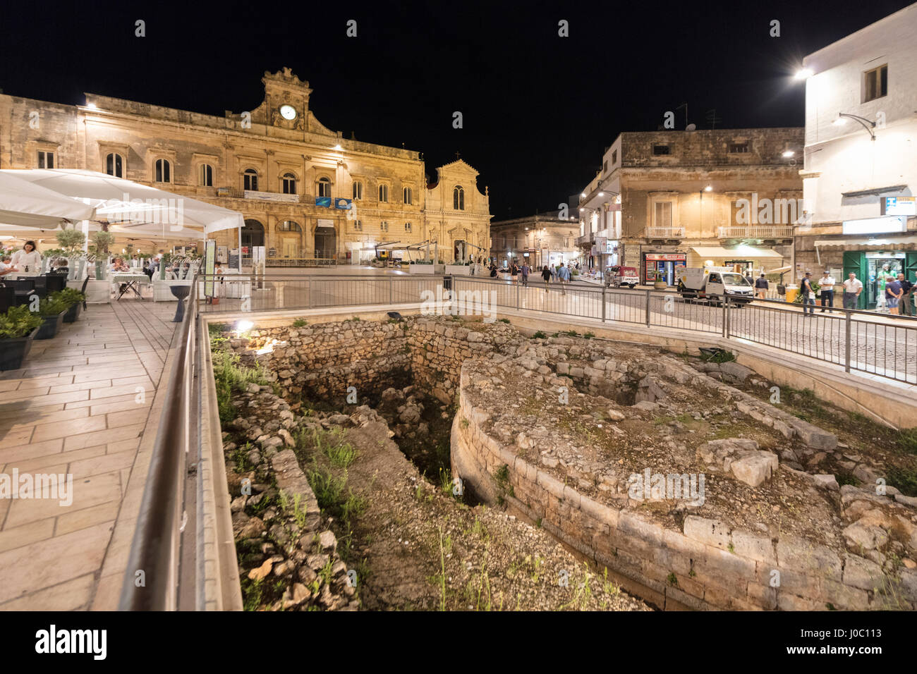 Night view of the Town Hall and ancient ruins in the medieval old town ...