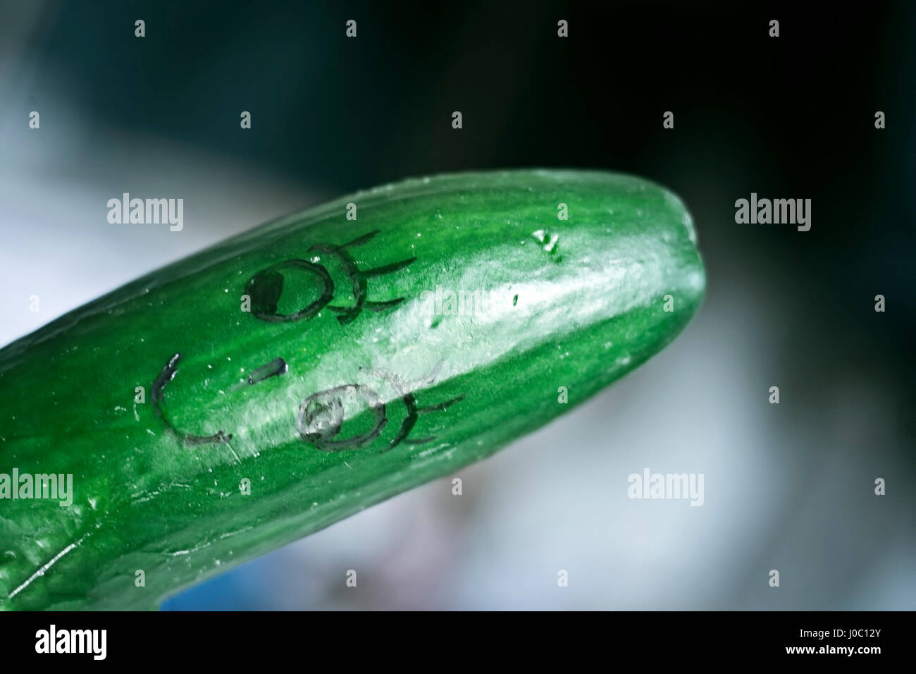 A calm cucumber smiling against the camera Stock Photo - Alamy