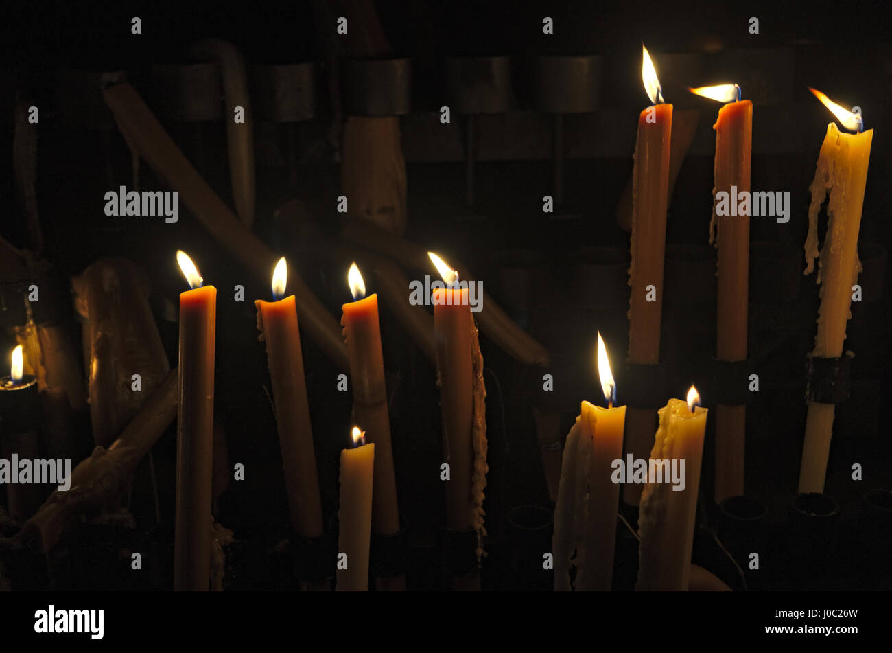 Candles lit at night in the Sanctuary of Our Lady of Fatima. Fatima ...