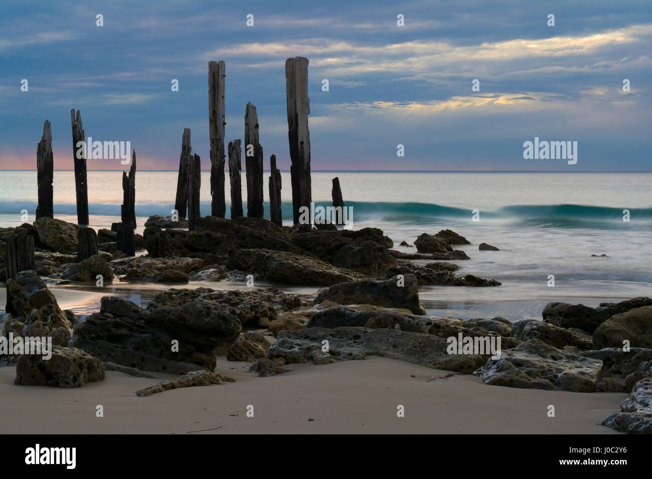 The jetty ruins at Port Willunga, South Australia at sunset. Slow ...