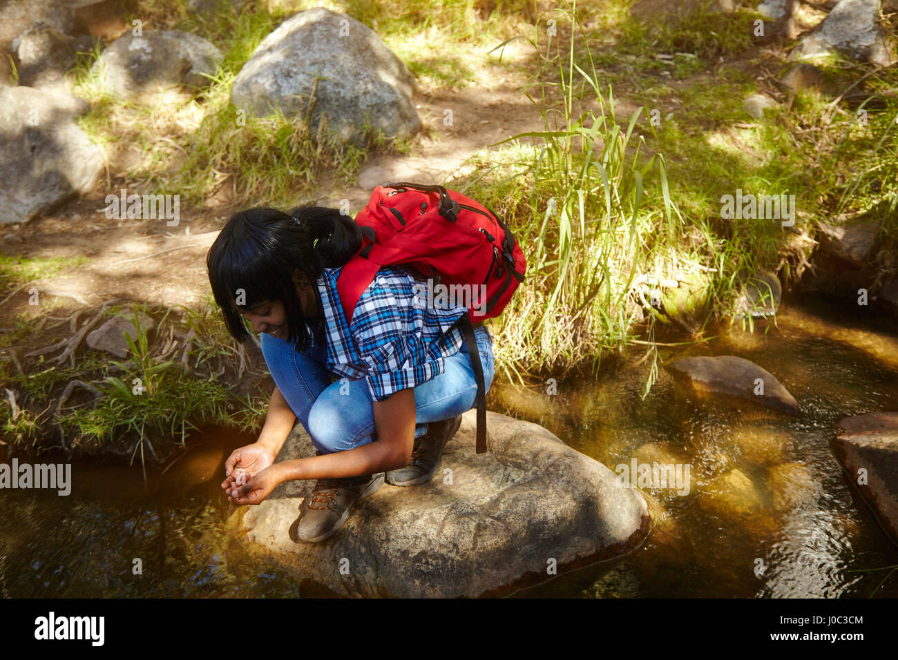Crouching on rock hi-res stock photography and images - Alamy