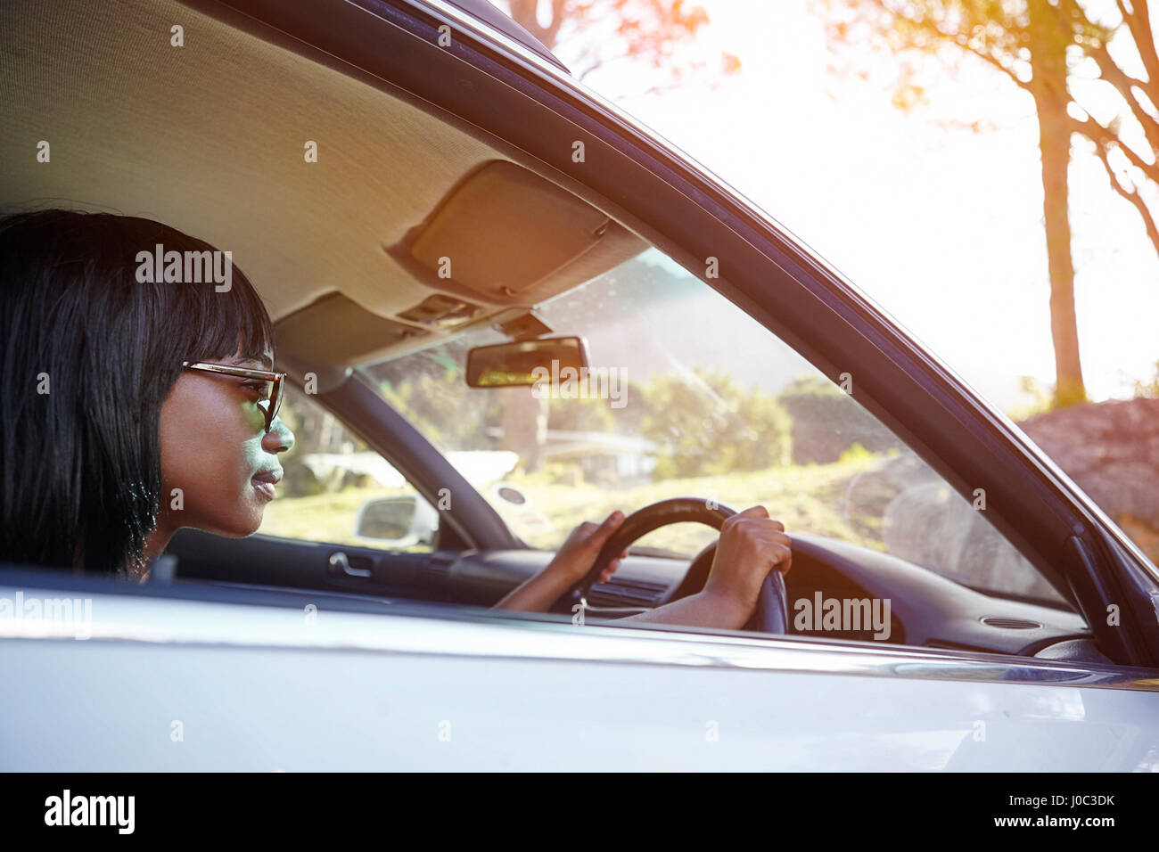 Woman driving car hi-res stock photography and images - Alamy
