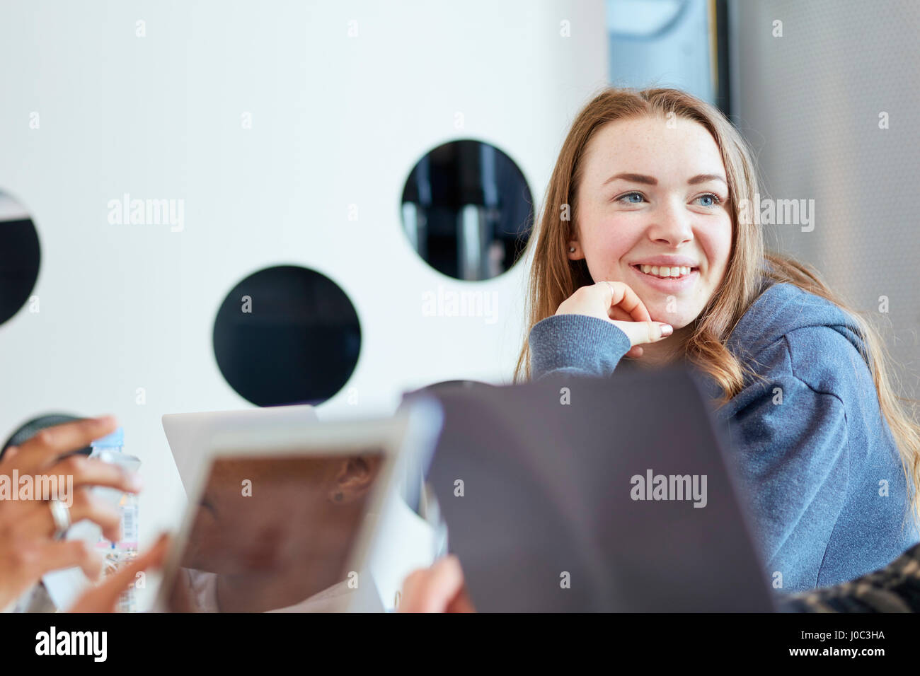 University students using laptops and digital tablet, working together ...