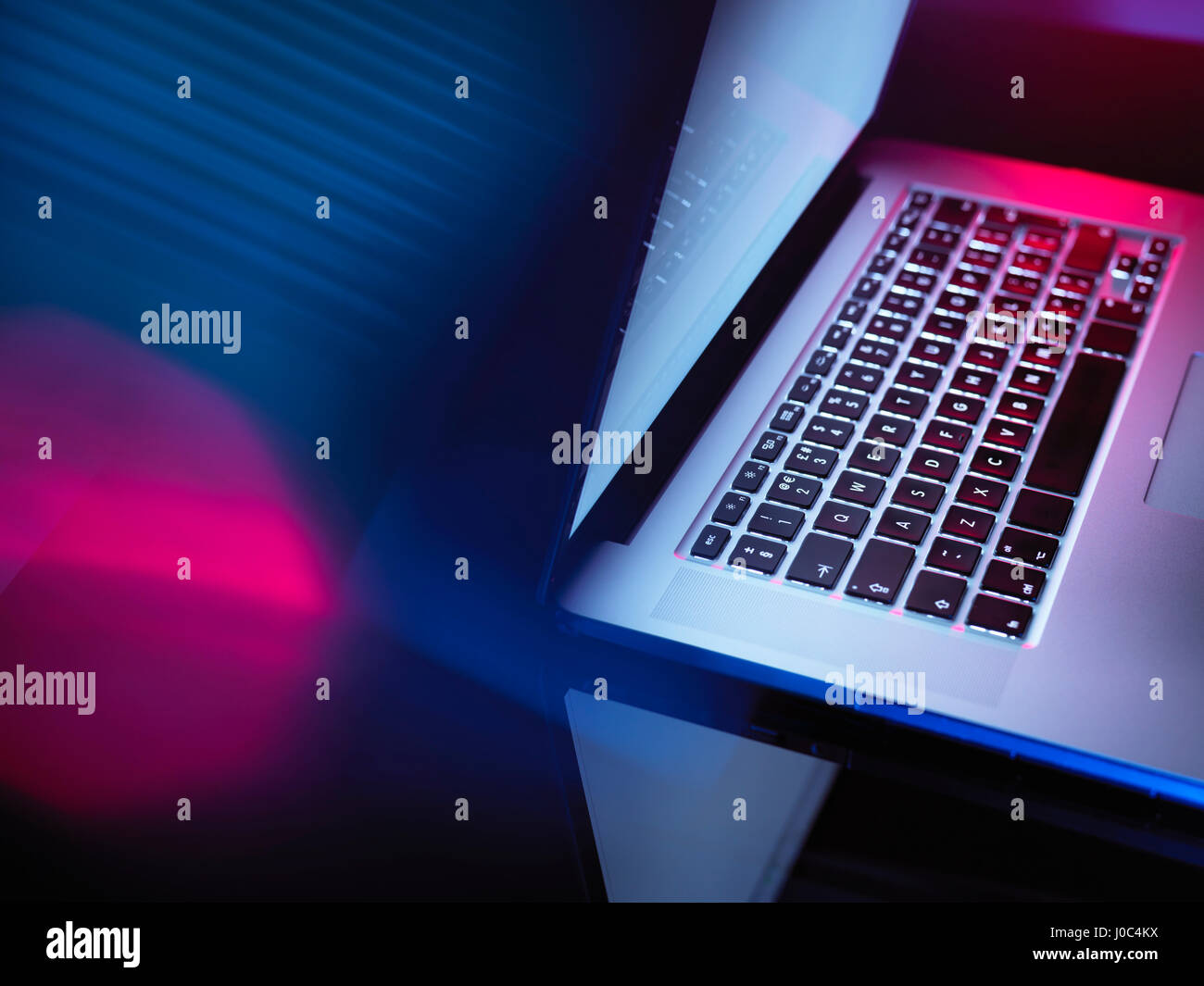 Data streaming into laptop computer Stock Photo - Alamy