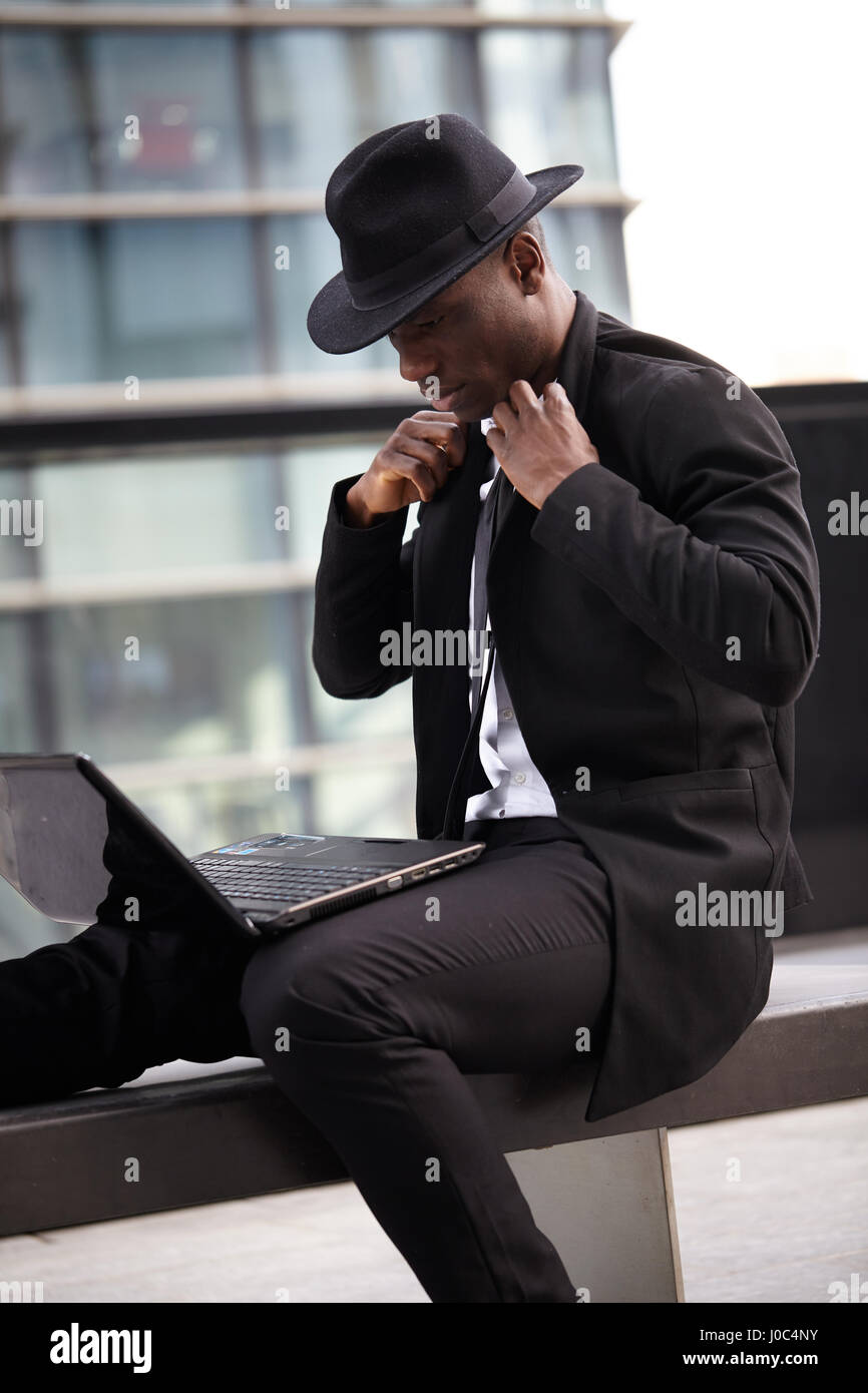 Professional using computer outdoor hi-res stock photography and images ...