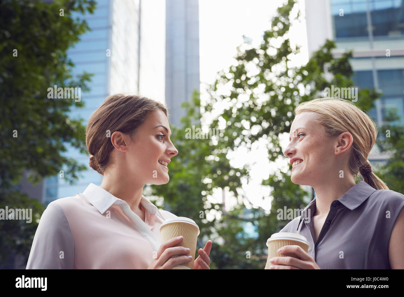 Business women having coffee break, London, UK Stock Photo - Alamy