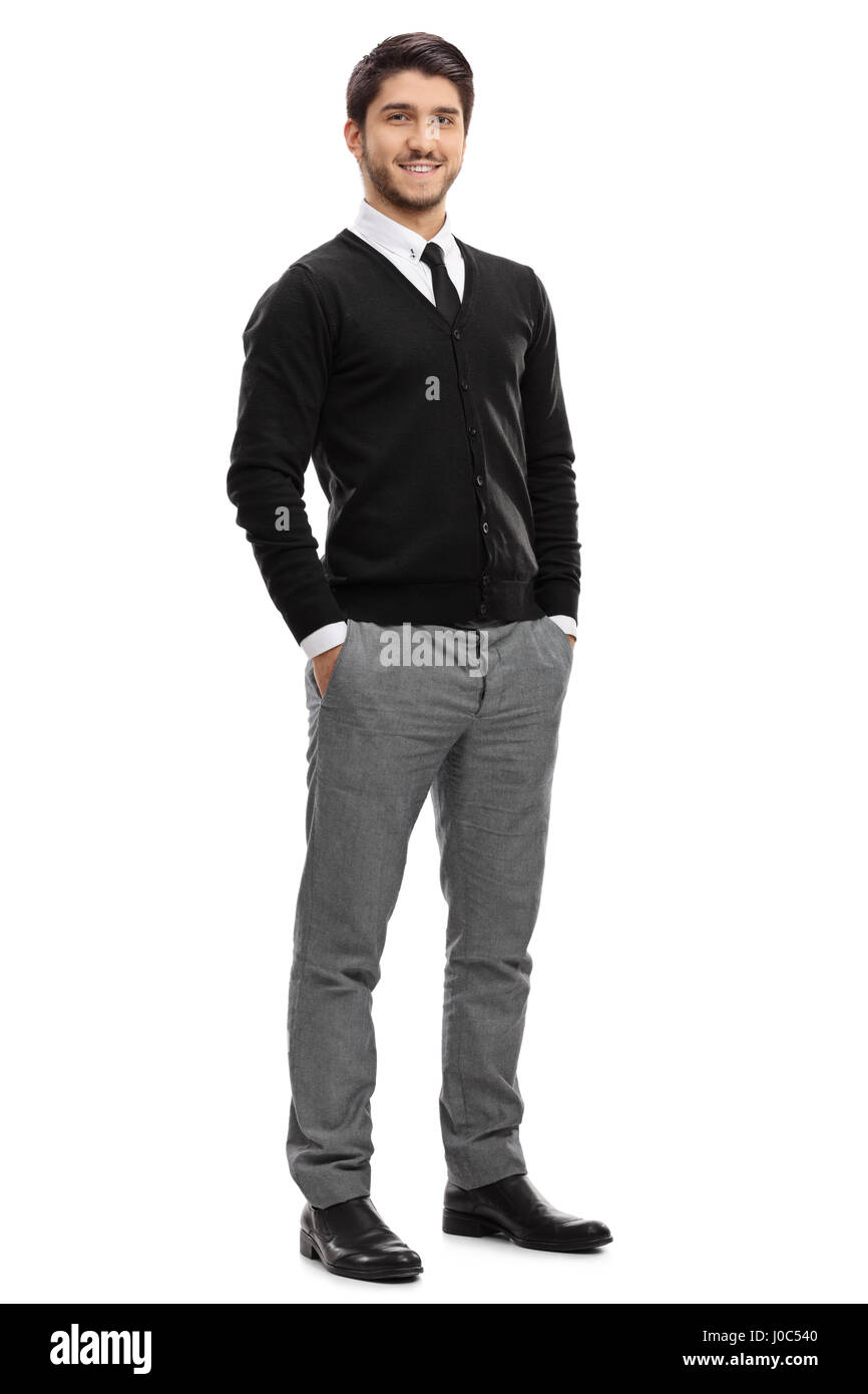 Full length portrait of an elegant young man looking at the camera and ...