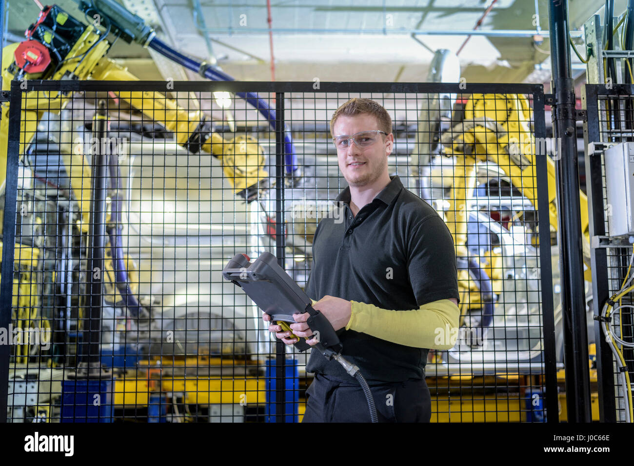 Engineer working on robot arm hi-res stock photography and images - Alamy