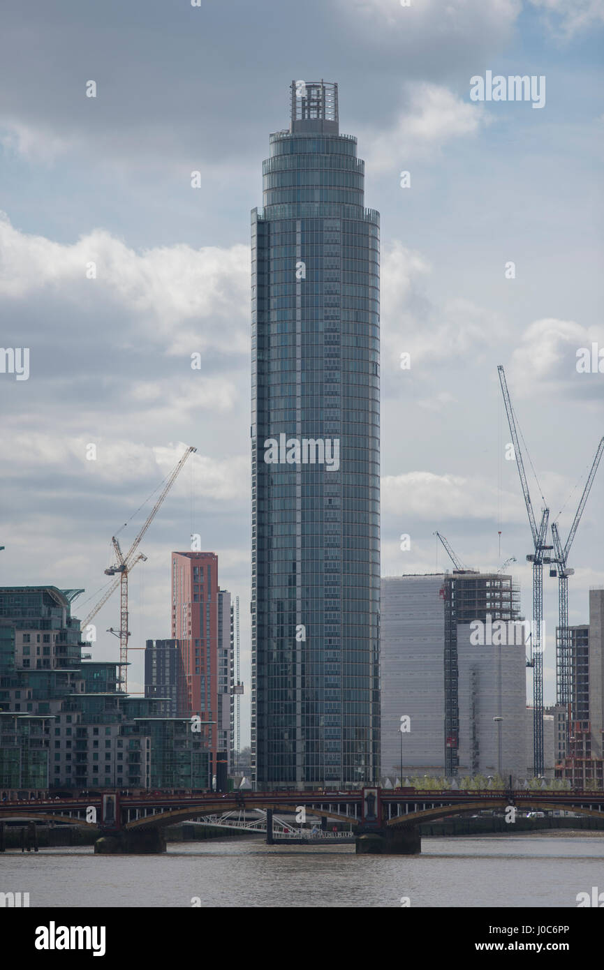 St George Wharf Tower at Vauxhall in London with construction cranes at ...