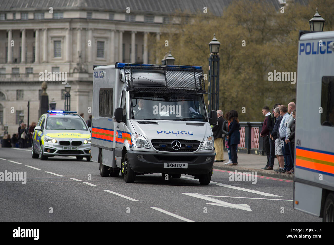Police escort vehicles cross Lambeth Bridge behind the funeral cortege ...