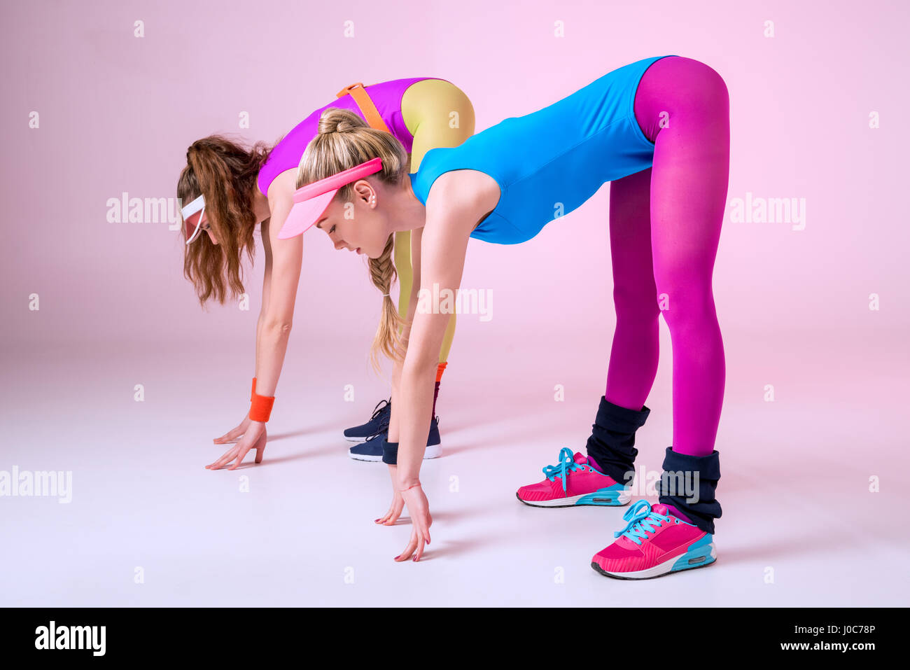 young sporty women doing aerobic exercises on pink Stock Photo - Alamy