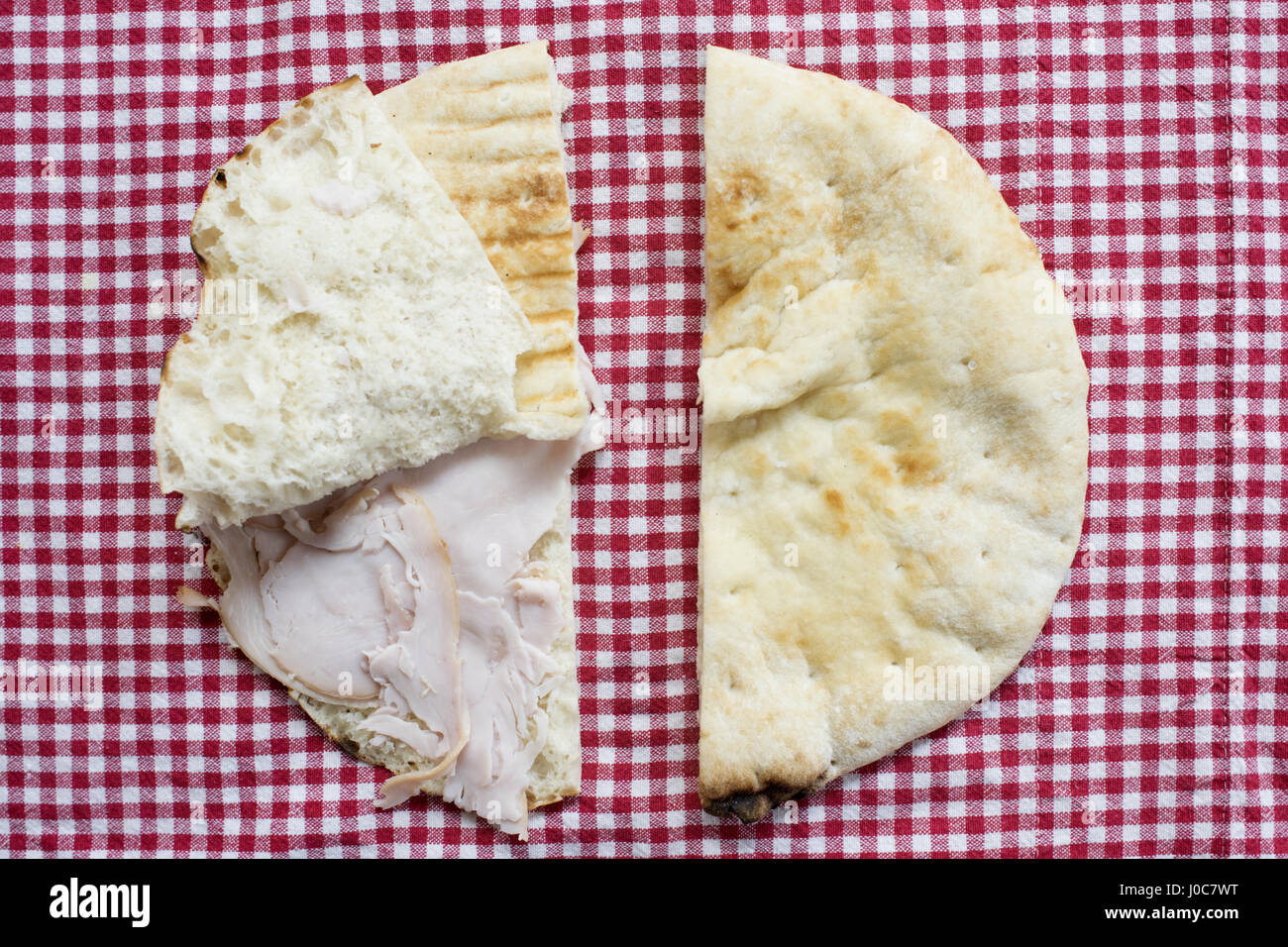 toasted flat bread stuffed with cooked ham.flat lay Stock Photo - Alamy