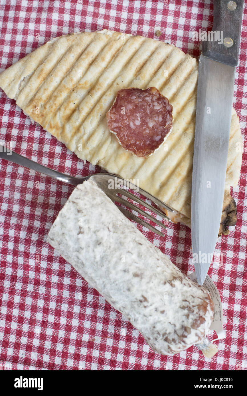 toasted flat bread stuffed with salami.flat lay Stock Photo - Alamy